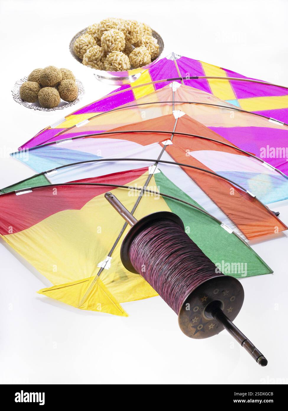 Colourful five kites thread manja firki with sesame puffed rice laddoo ...