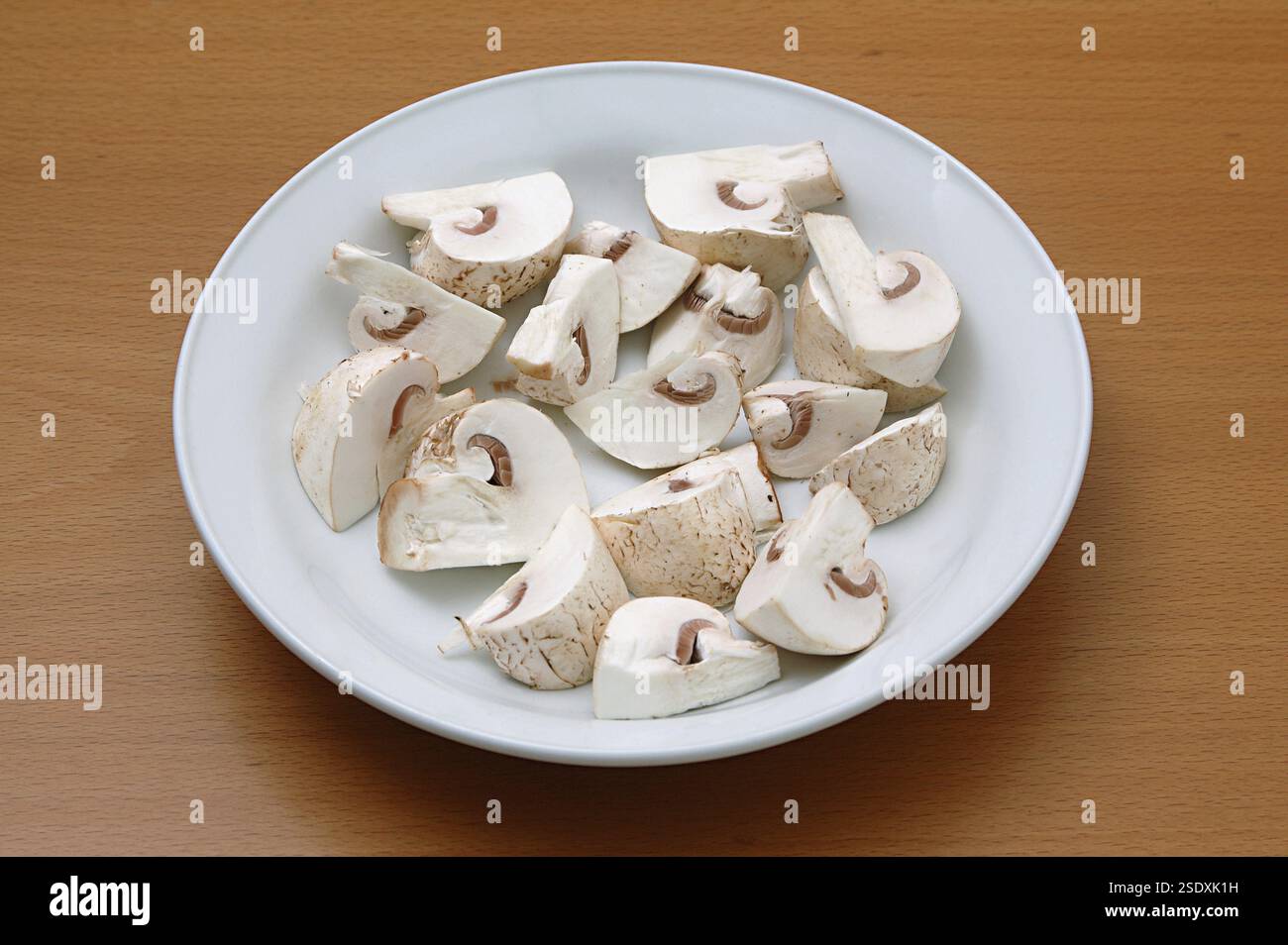 Vegetable, white button mushroom shape chopped mushroom in the plate ...