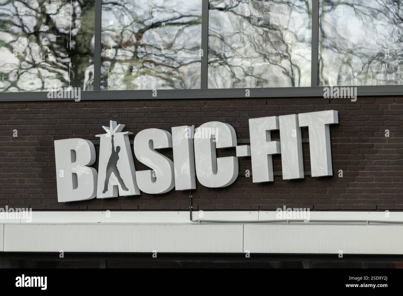 Basic Fit logo at the gym. Basic-Fit is the largest fitness chain in ...