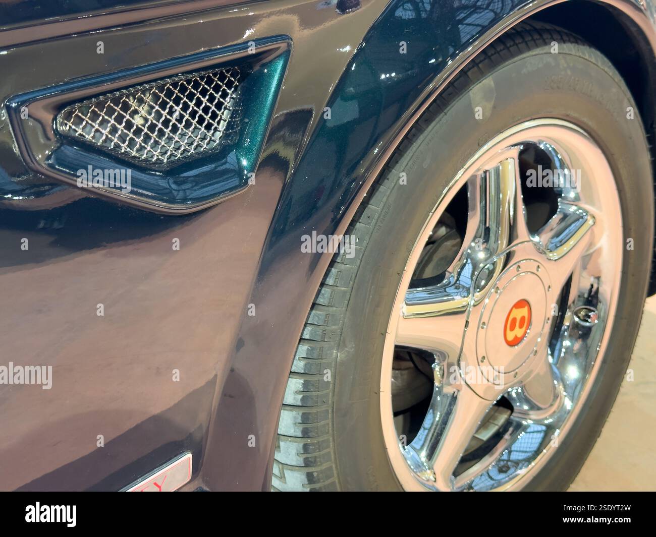 Sleek automotive craftsmanship highlighted by detailed alloy wheel ...