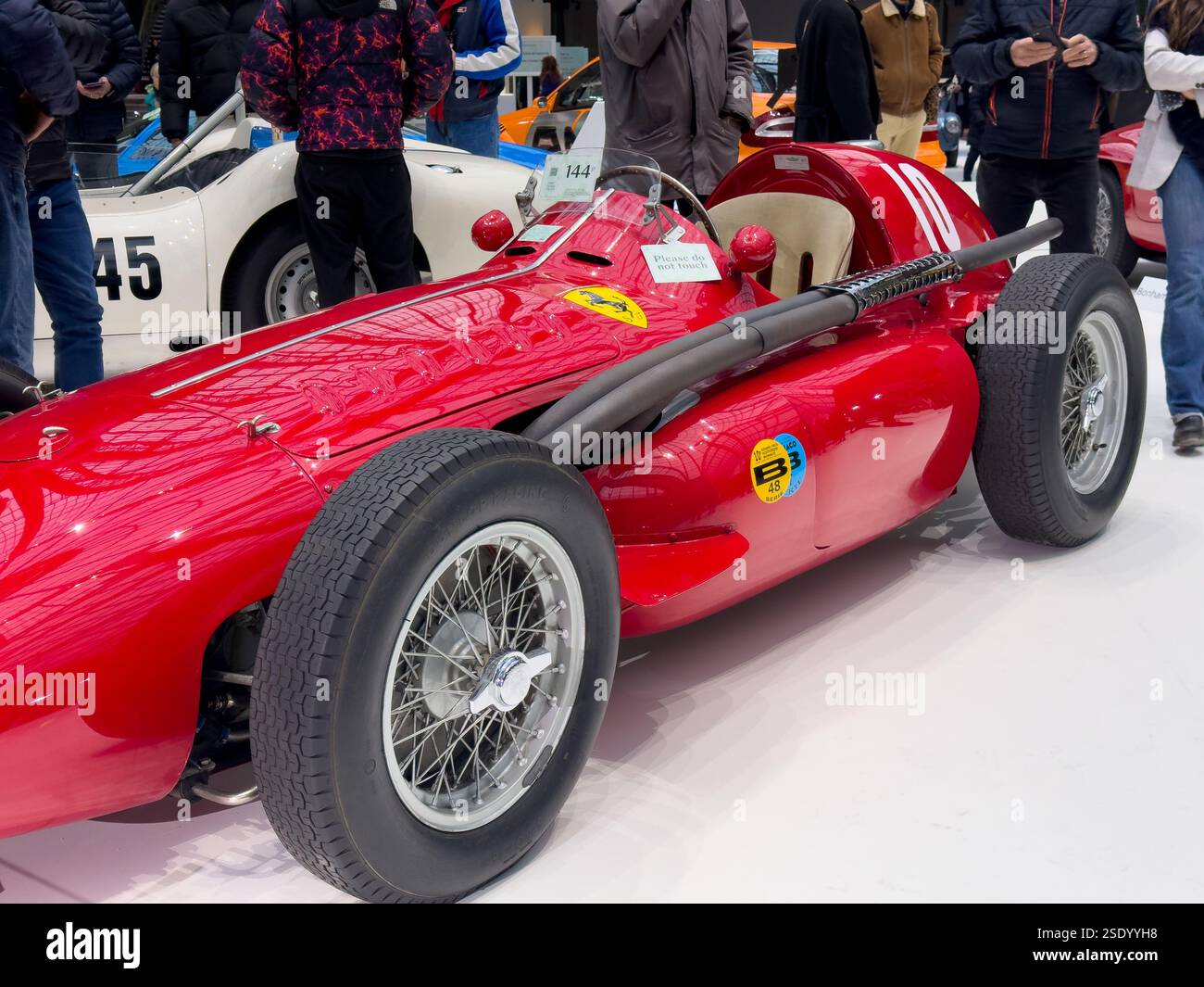 Classic racing car showcases automotive history in vibrant red color ...