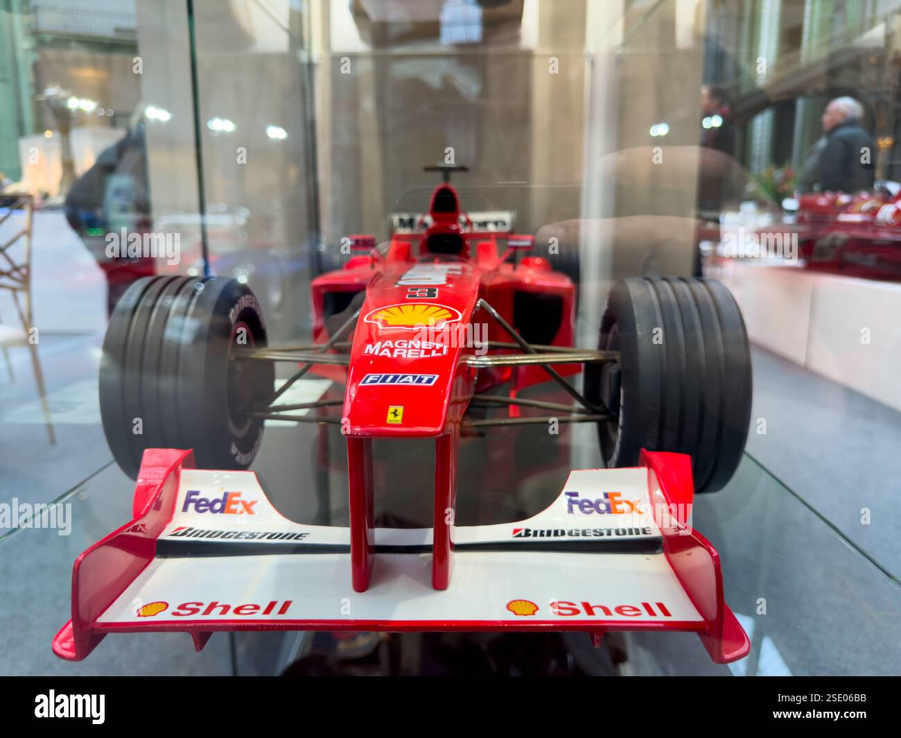 Model race car showcased in a lively automotive exhibition Stock Photo ...