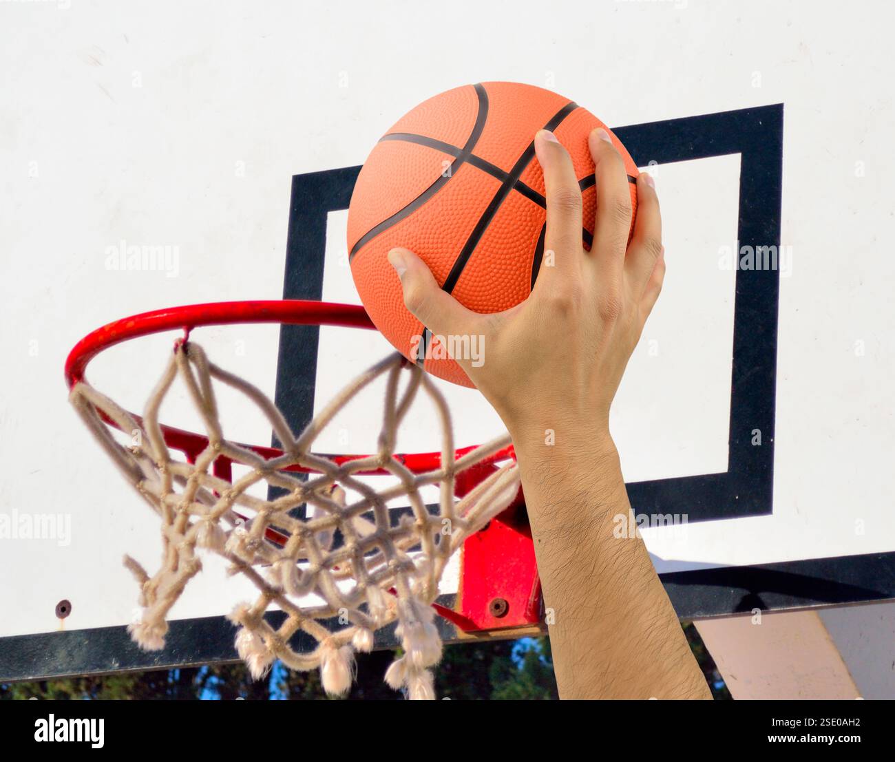 Basketball player shooting against backboard hi-res stock photography ...