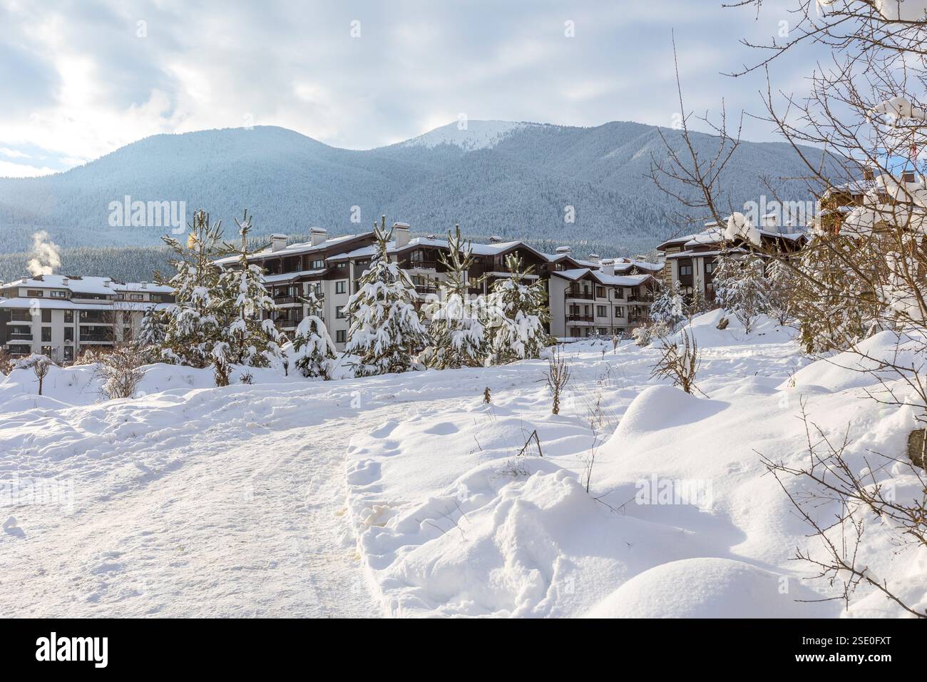Bansko, Bulgaria winter street view, houses and Pirin snow mountain ...