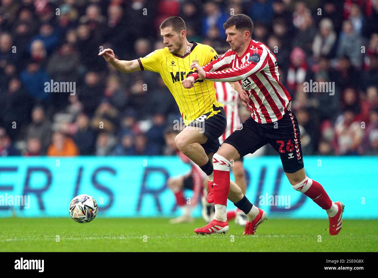Watford's Giorgi Chakvetadze (left) and Sunderland's Chris Mepham ...