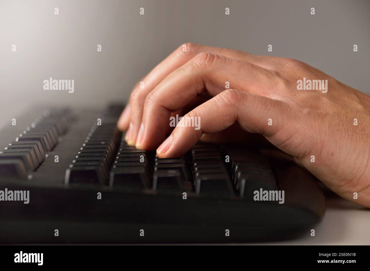 close up of a male hand using a computer keyboard thumb.Playing ...