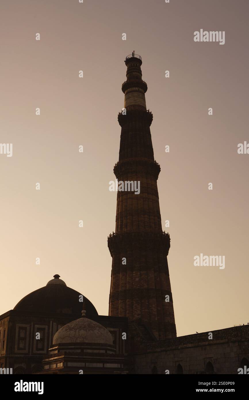 Sunset at Alai Darwaza Imam Zamin's tomb and Qutab Minar built in 1311 ...