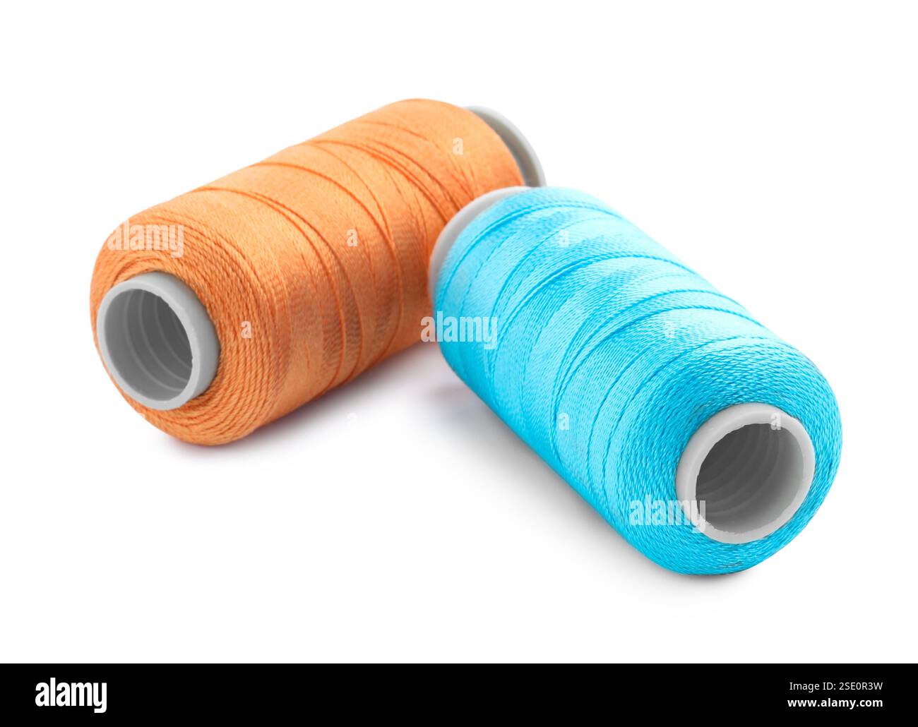 Spools of bright sewing threads isolated on white Stock Photo - Alamy