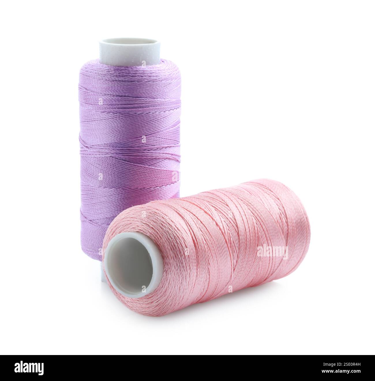 Spools of bright sewing threads isolated on white Stock Photo - Alamy
