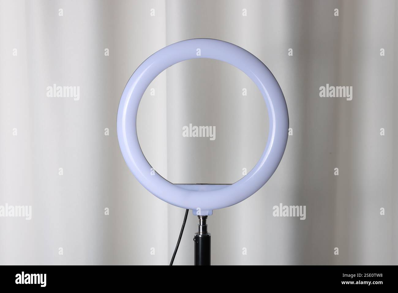 One ring lamp near light curtain. Photo and video equipment Stock Photo ...