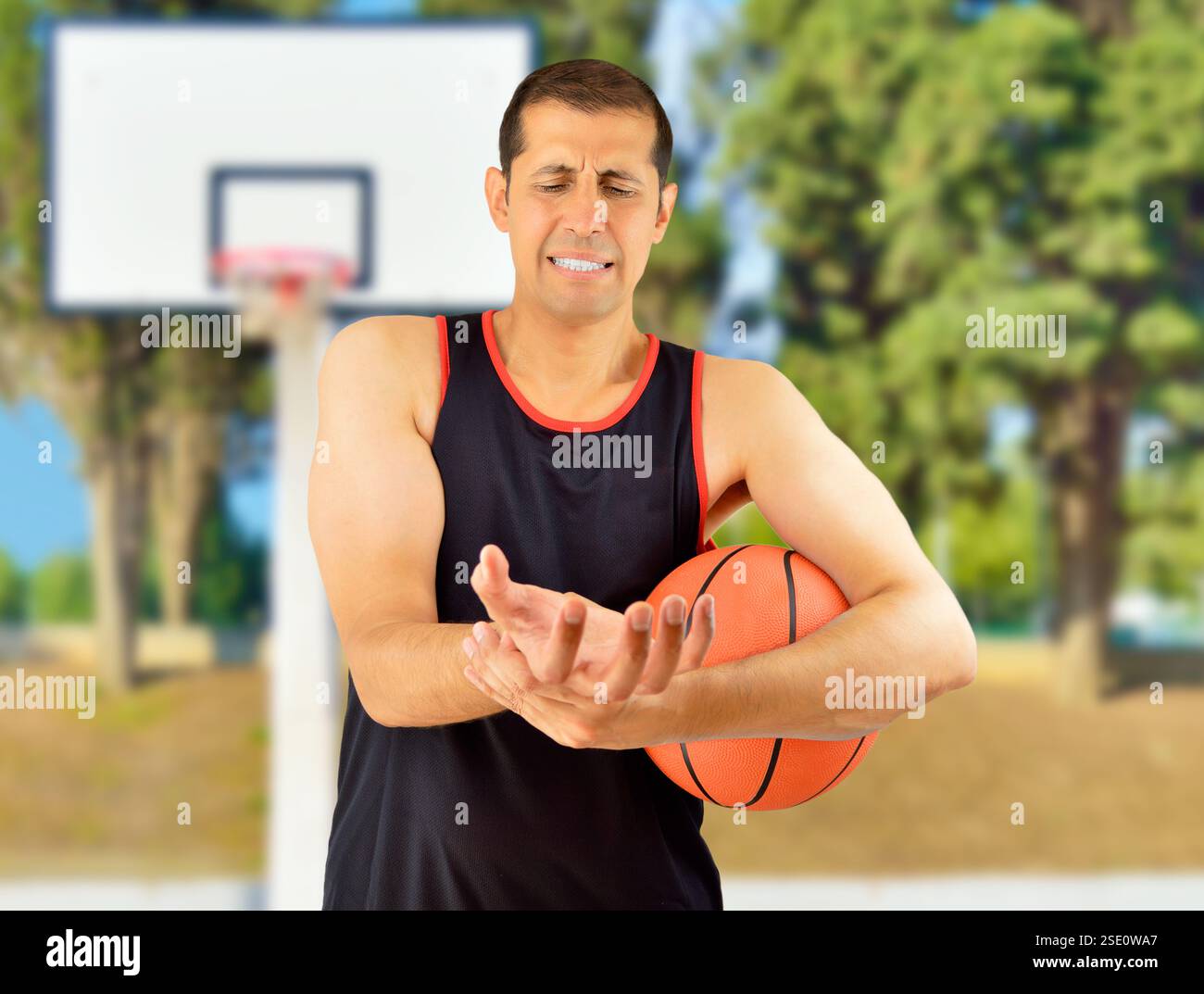 basketball player with a wrist injury at outdoors Stock Photo - Alamy