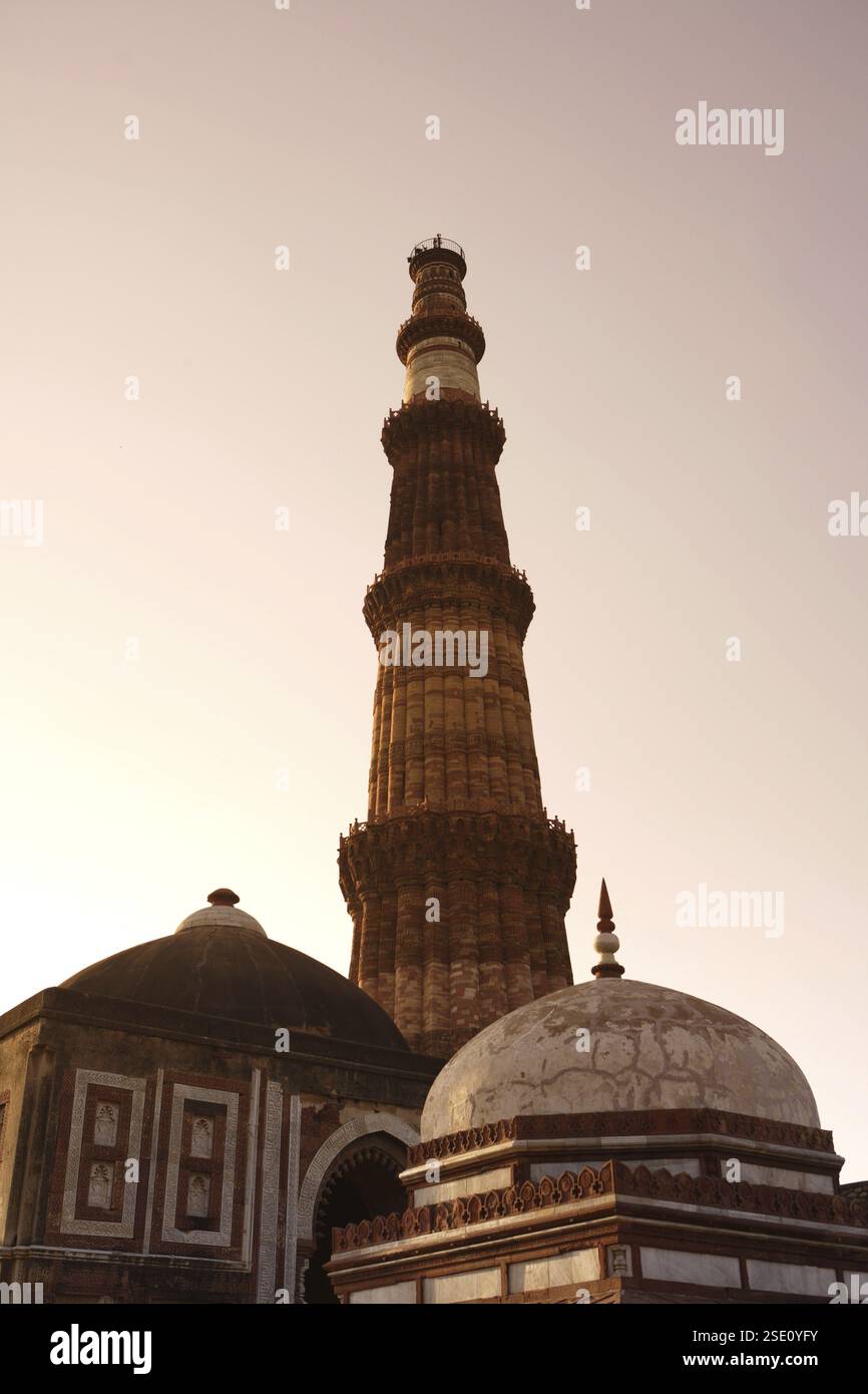 Sunset at Alai Darwaza Imam Zamin's tomb and Qutab Minar built in 1311 ...