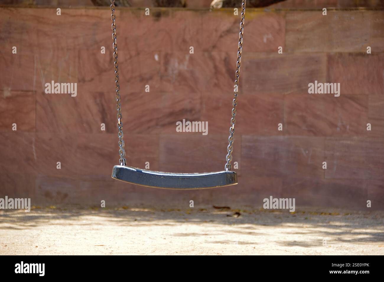 shot of empty chain swing at the playground Stock Photo - Alamy