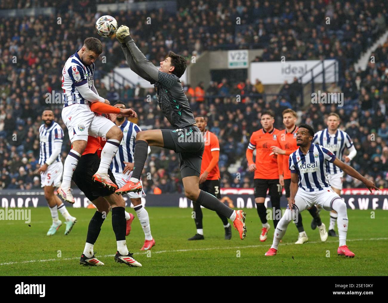 Sheffield Wednesday goalkeeper James Beadle clears under pressure from ...