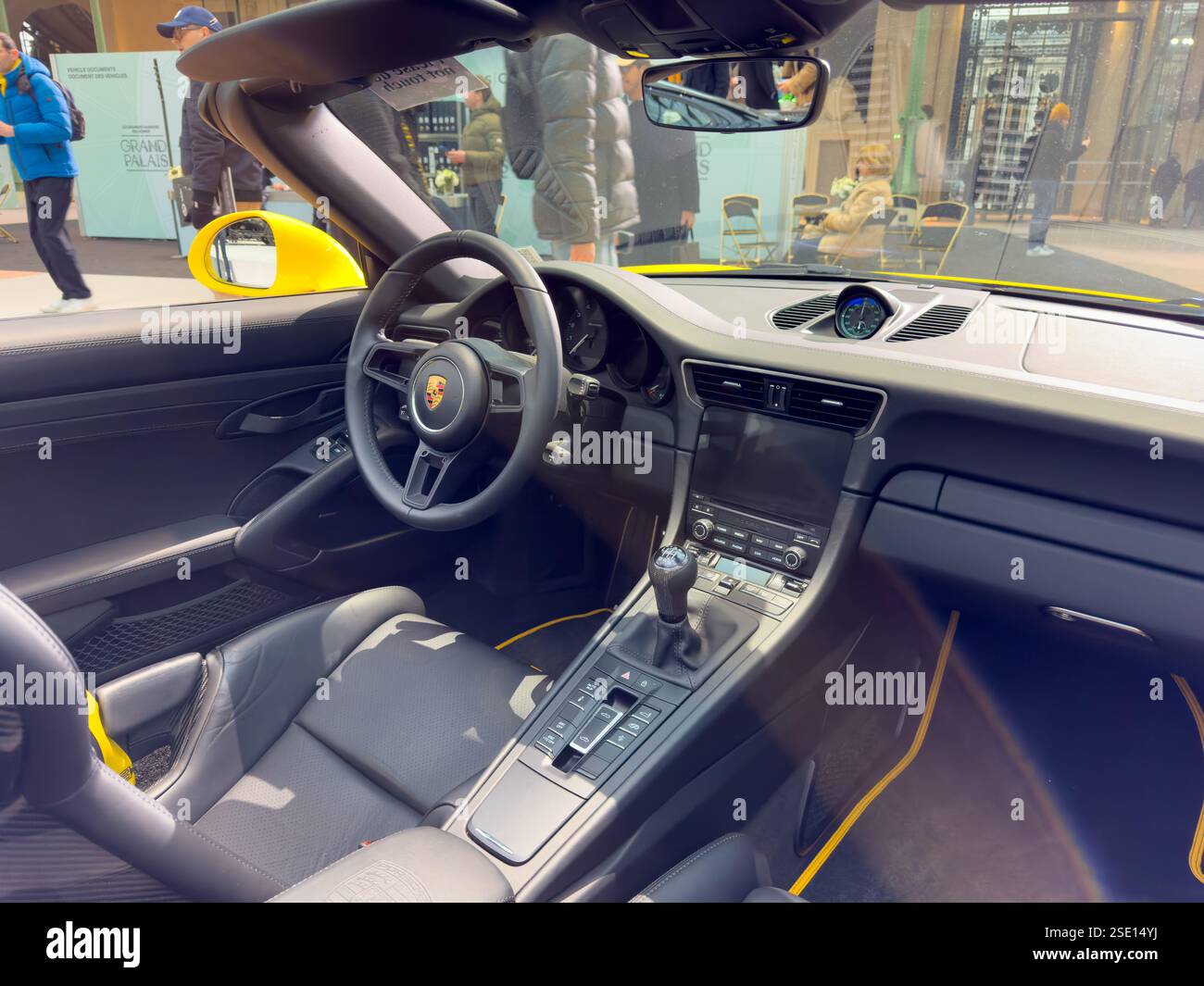 Interior of a sleek sports car showcased in a vibrant urban environment ...