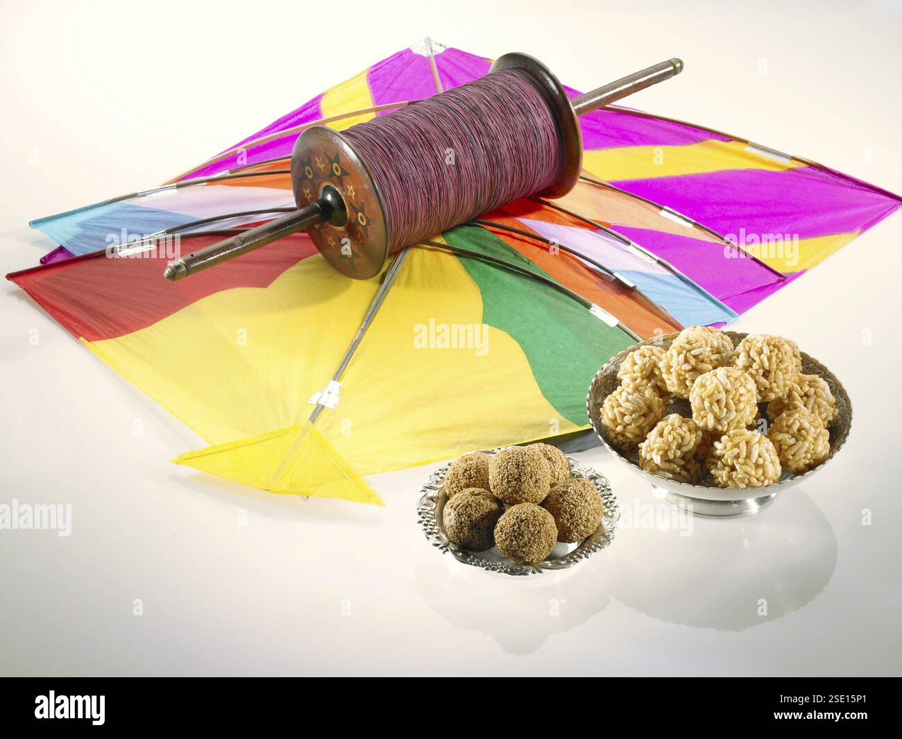 Colourful five kites thread manja firki with sesame puffed rice laddoo ...