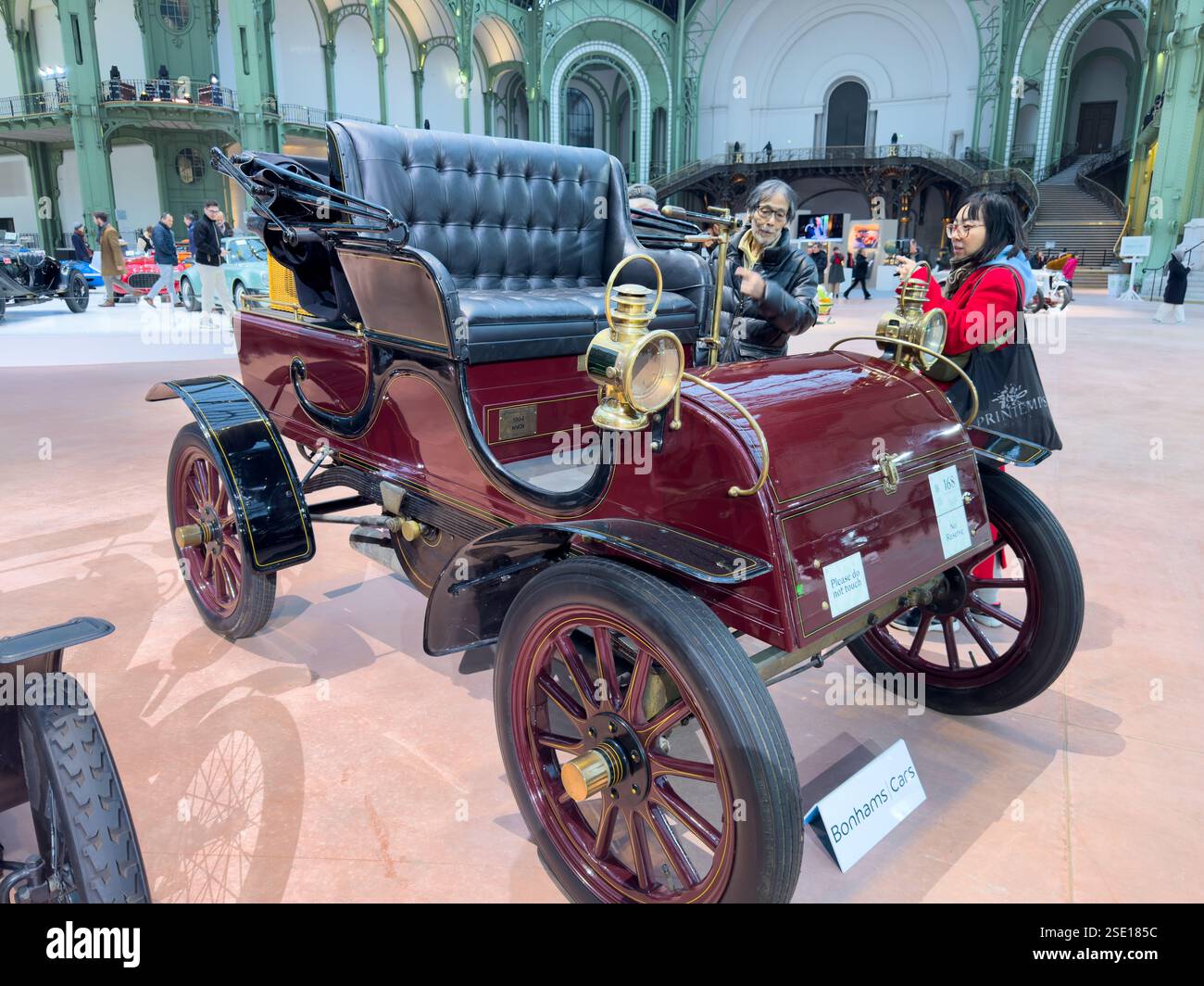Vintage automobile exhibition featuring a classic 1900s carriage ...