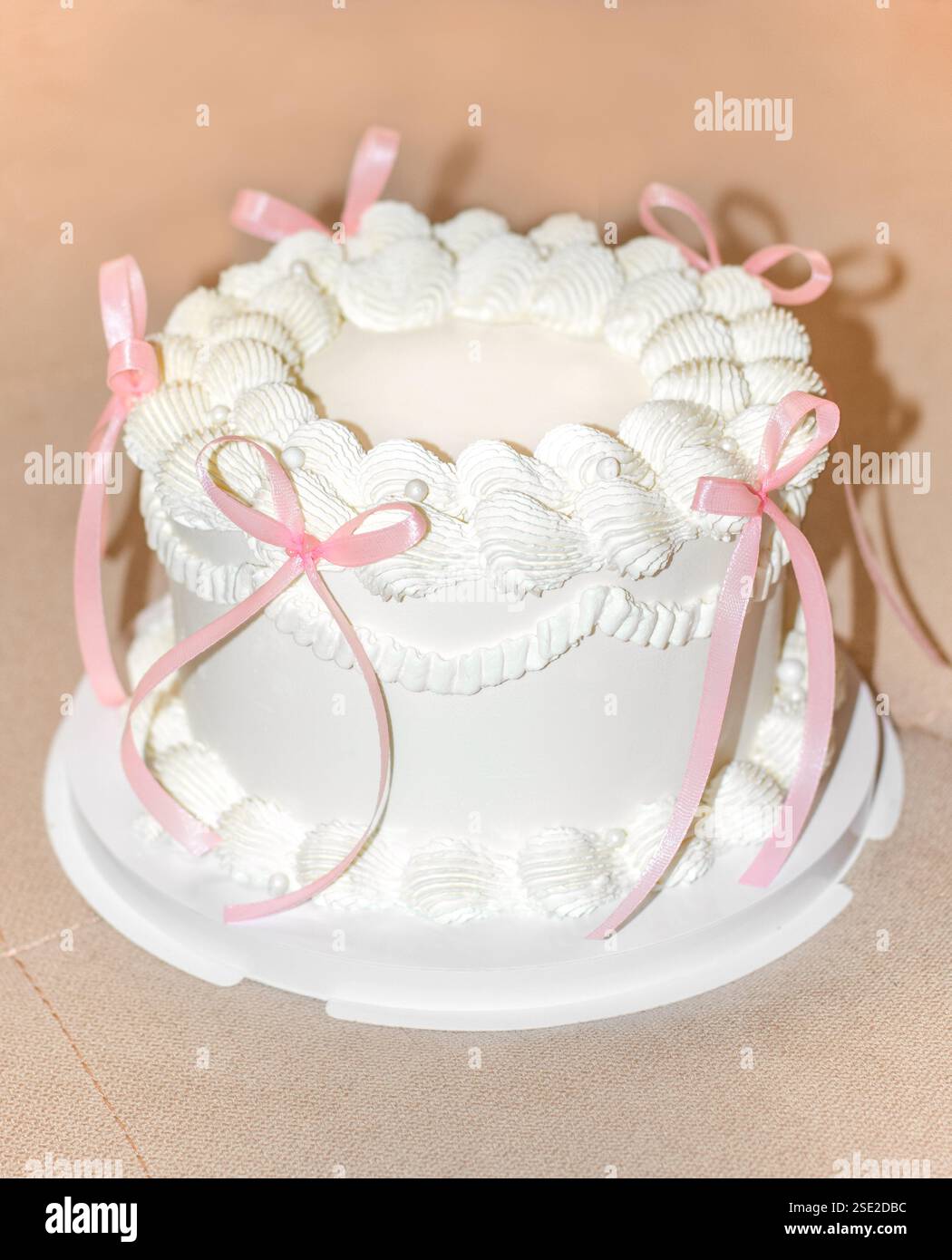 vintage cake with pink bows of delicate cream color Stock Photo - Alamy