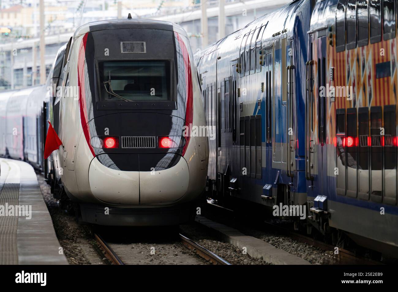 Red and blue trains stationing at the station of Nice, France, red ...