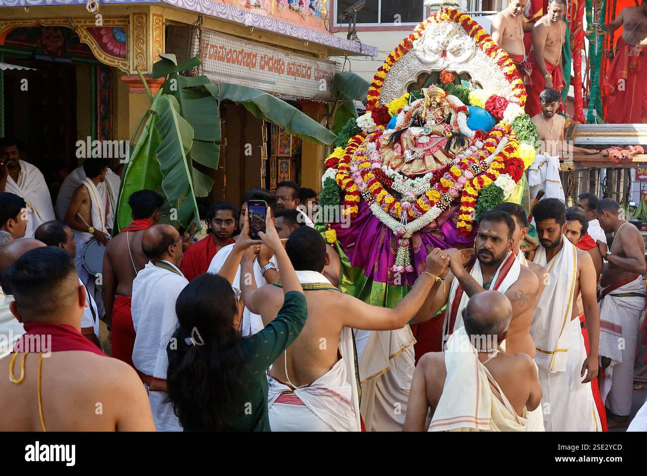 An image of the goddess Chowdeshwari is carried by members of the ...