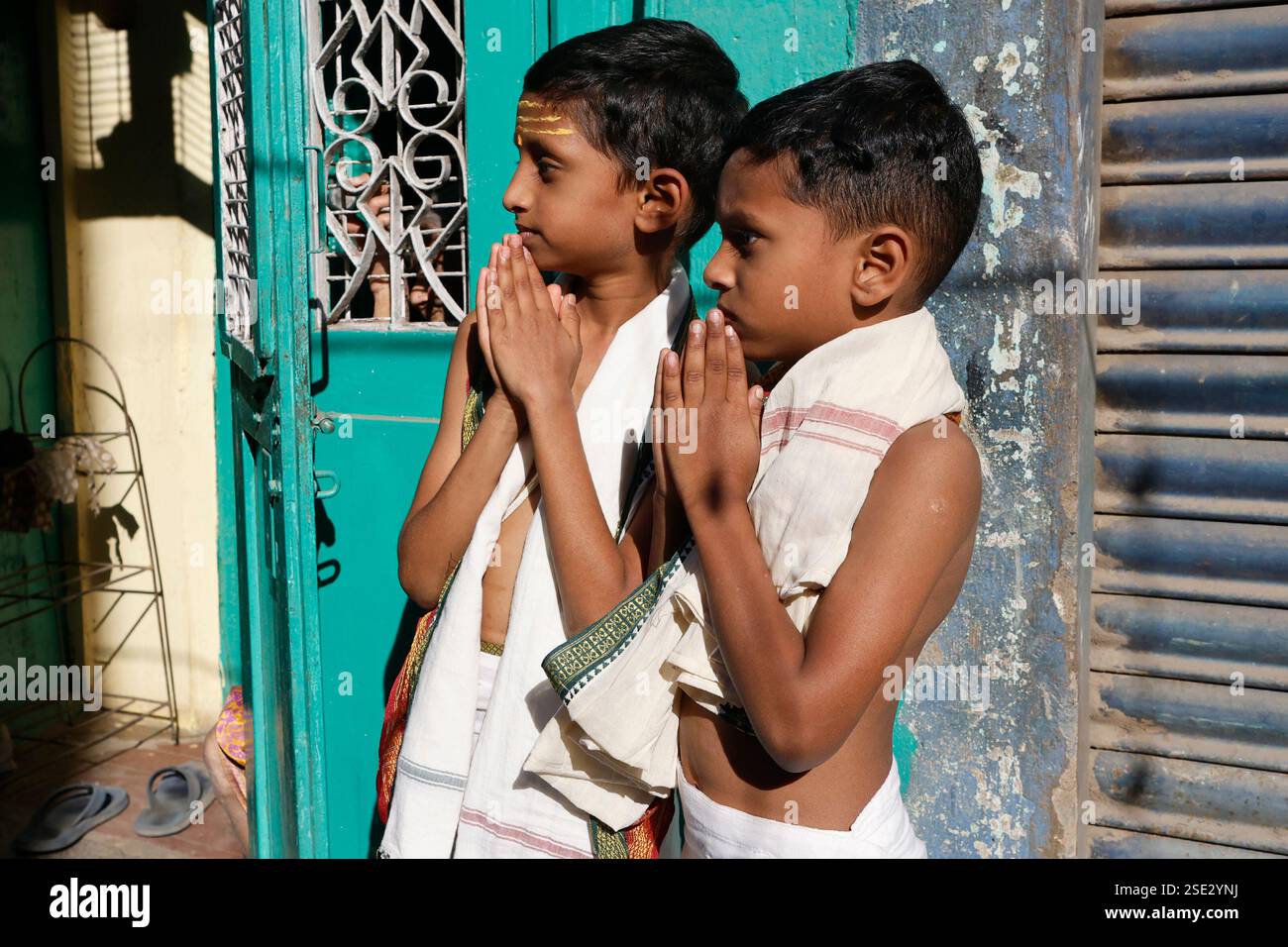 Two boys from the Devanga (weavers) caste praying in Mysuru (Mysore ...