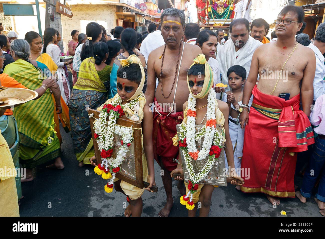 Two boys from the Devanga (weaver's caste) lead a procession to ...