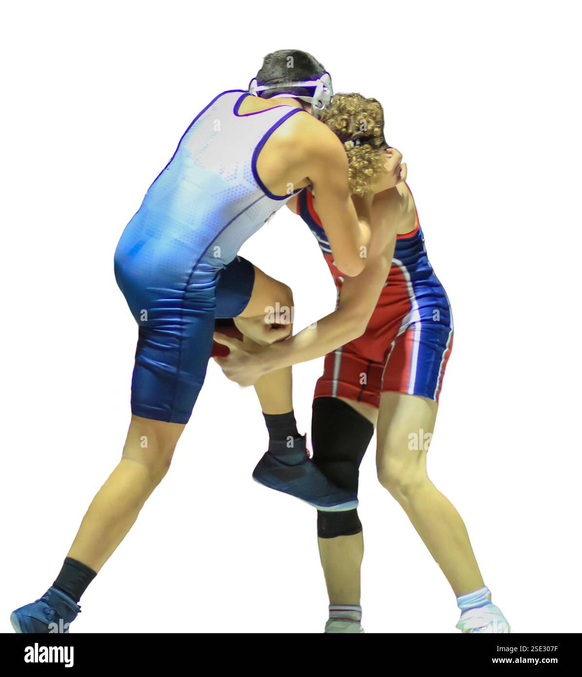 Two male athletes engage in a wrestling match, showcasing strength and ...