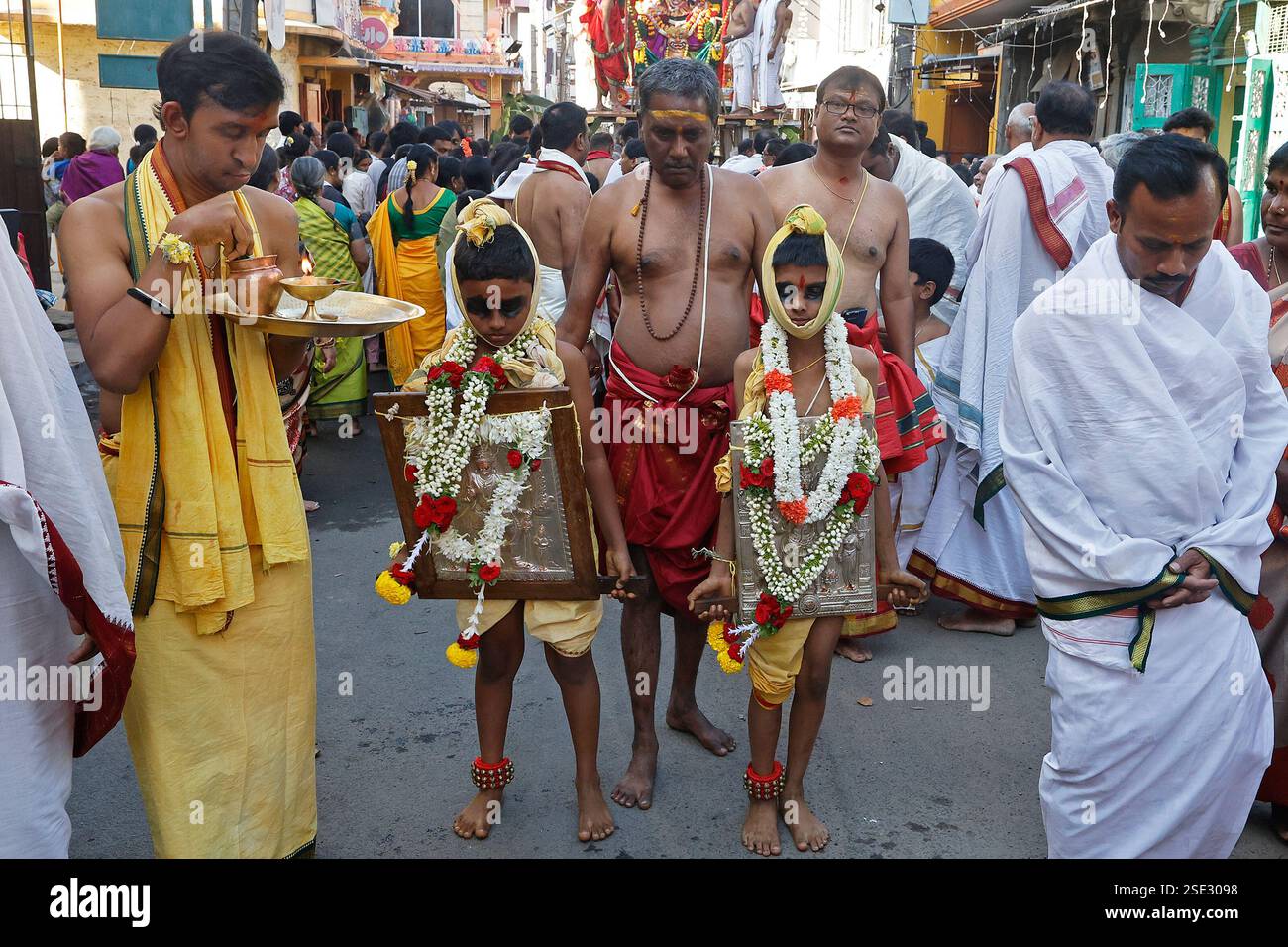 Two boys from the Devanga (weaver's caste) lead a procession to ...