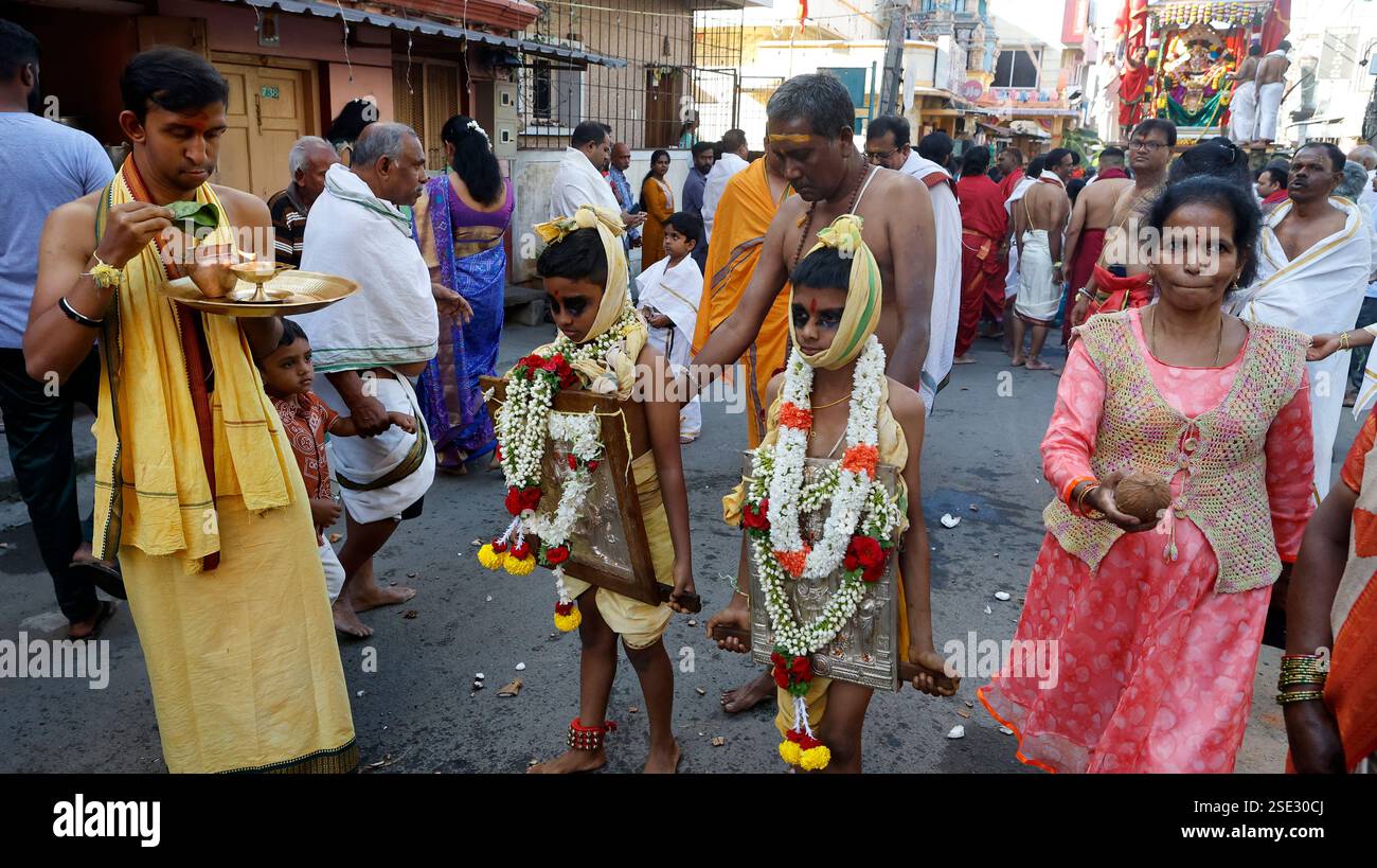 Two boys from the Devanga (weaver's caste) lead a procession to ...