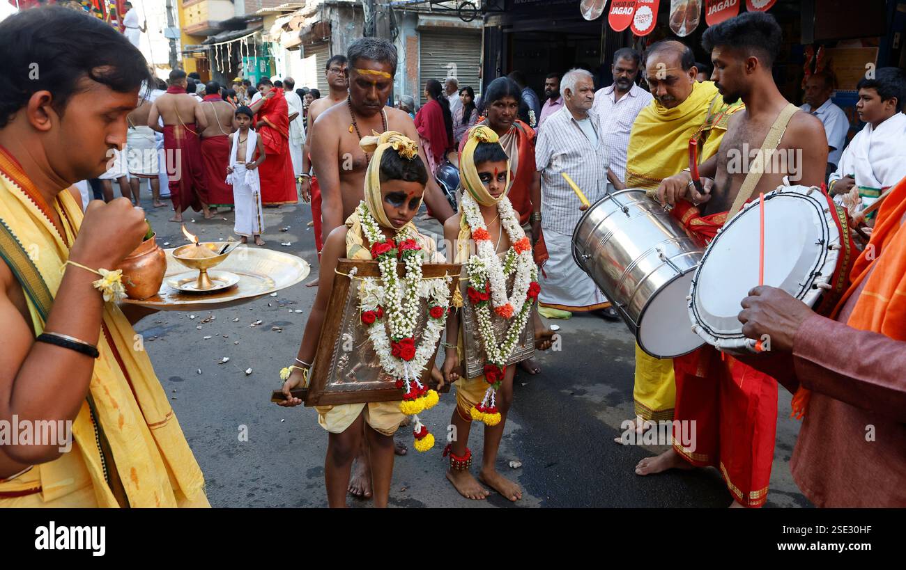 Two boys from the Devanga (weaver's caste) lead a procession to ...