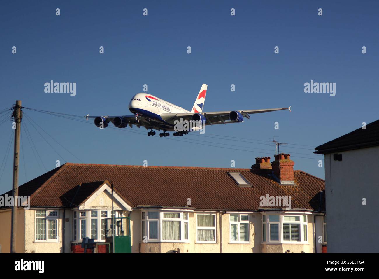 British Airways Airbus A380-841 G-XLEI flies low over houses on Myrtle ...
