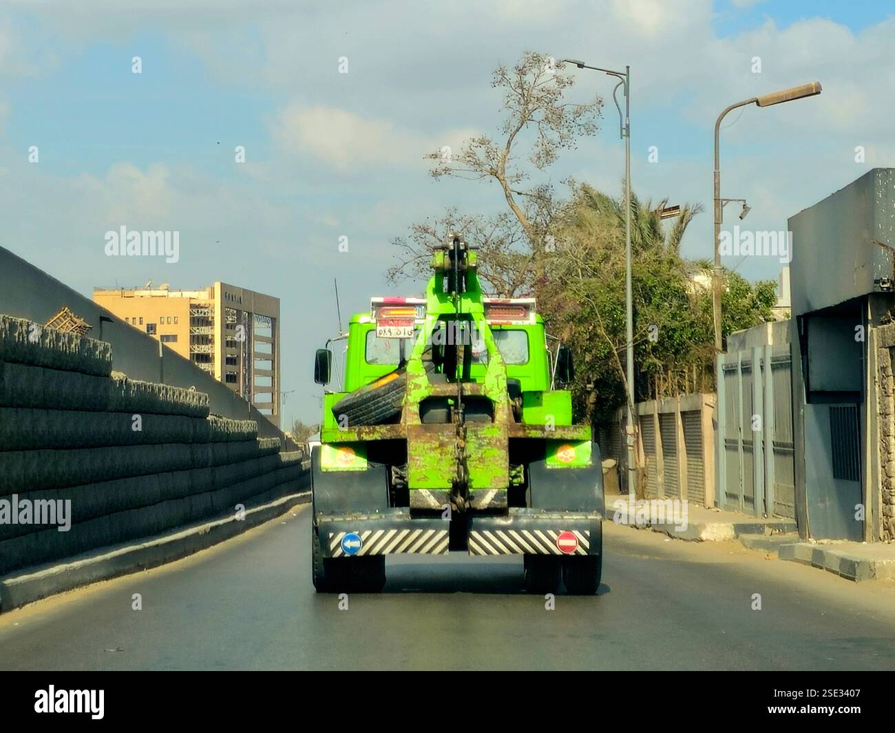 Cairo, Egypt, February 1 2025: A green tow truck, a wrecker, a ...