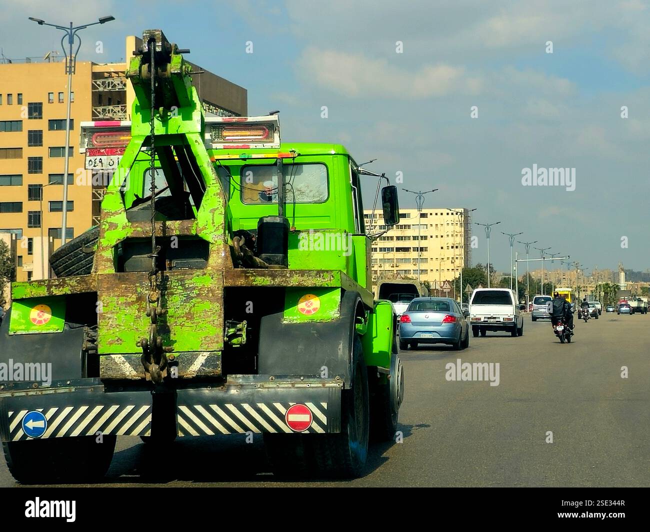 Cairo, Egypt, February 1 2025: A green tow truck, a wrecker, a ...