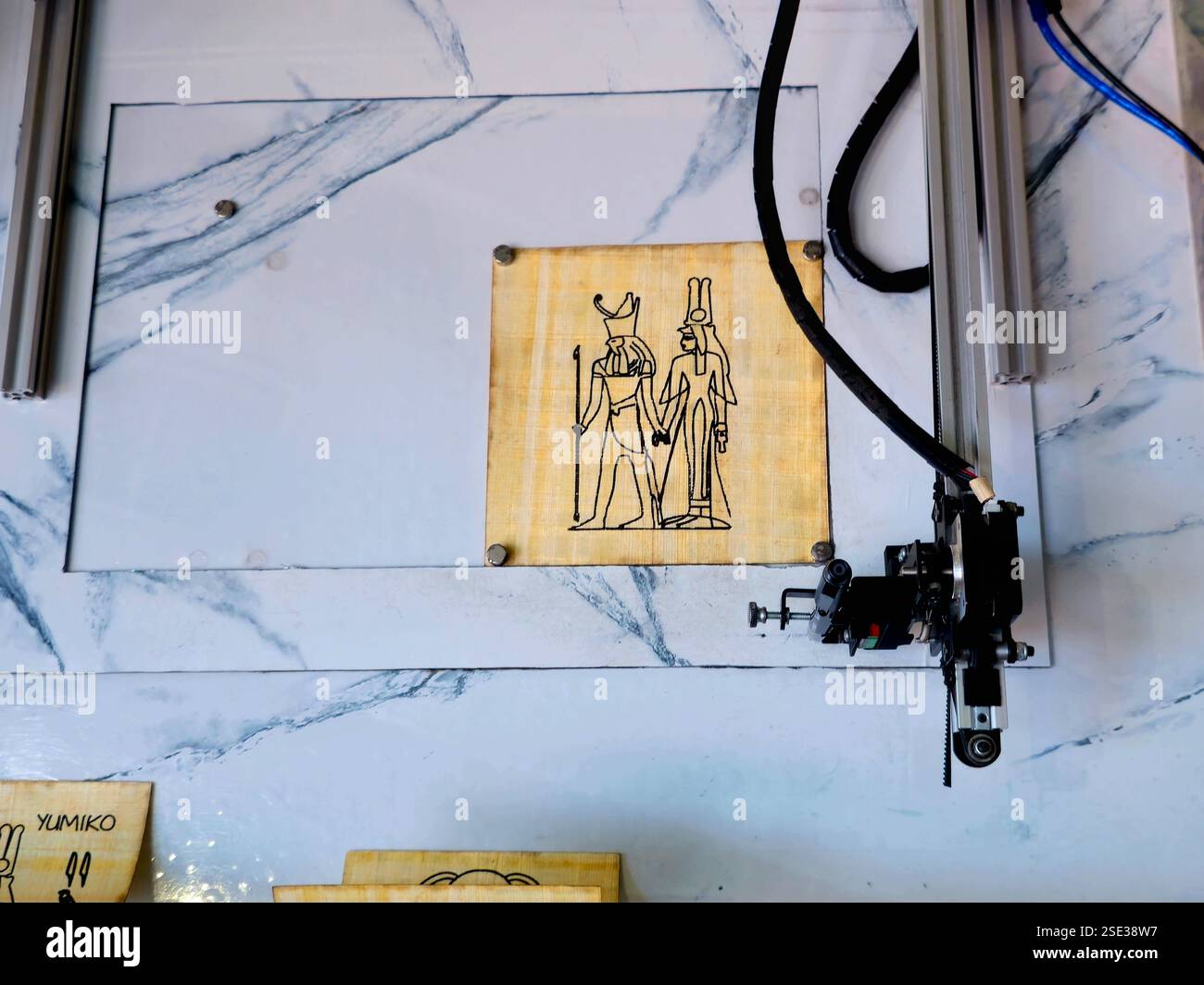 Cairo, Egypt, February 1 2025: Printing on papyrus the tourists names in Hieroglyphics and ...