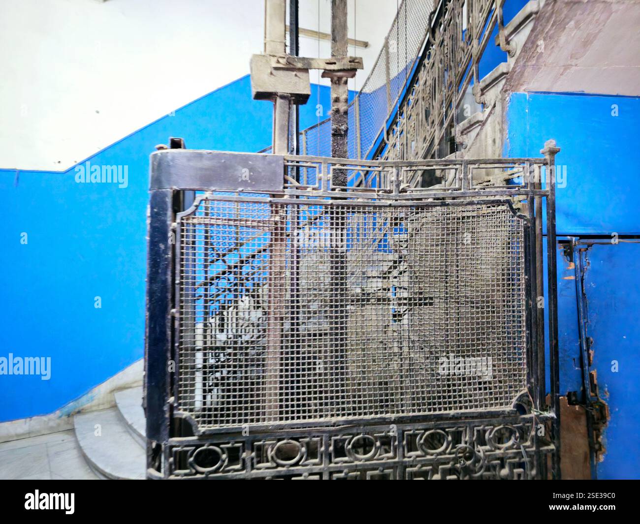 an elevator and its hoist way in an old building in Cairo downtown in ...