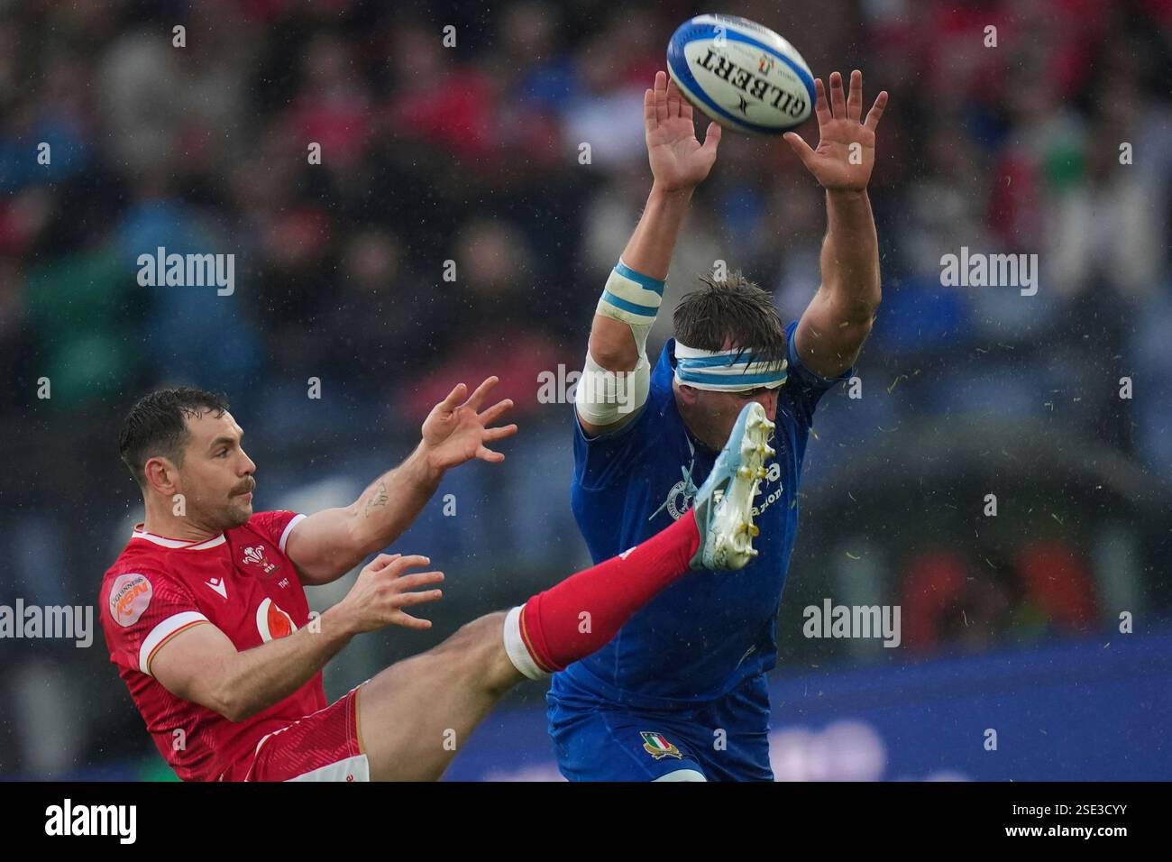 Wale's Tomos Williams, left, has his kick charged down by Italy's ...