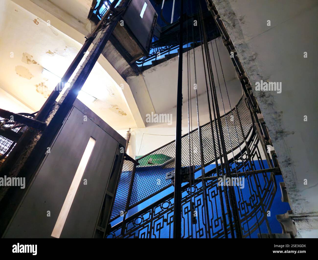 an elevator and its hoist way in an old building in Cairo downtown in Egypt, an elevator or lift ...