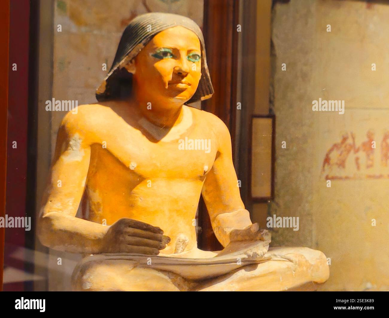 Cairo, Egypt, February 1 2025: Statue of ancient Egyptian seated scribe ...