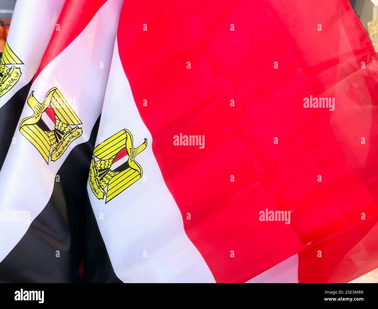 The national flag of Egypt, a tricolour consisting of the three equal ...