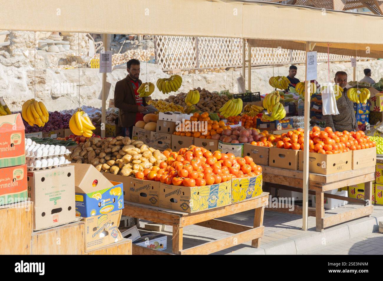 People selling fresh fruits and vegetables at the street market in A ...
