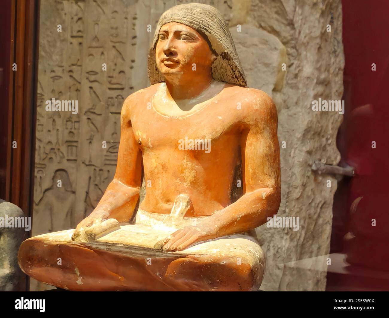 Cairo, Egypt, February 1 2025: Statue of ancient Egyptian seated scribe ...