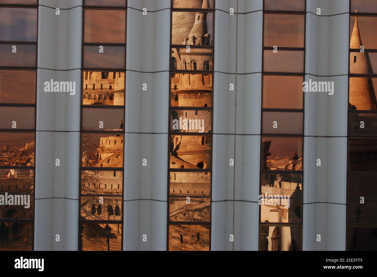 The Fisherman’s Bastion reflected in the mirrored windows of a ...