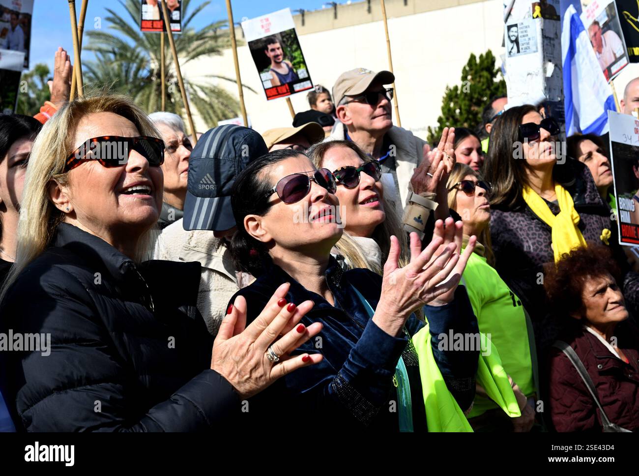 People watch on a large screen in Hostage Square in Tel Aviv, the ...