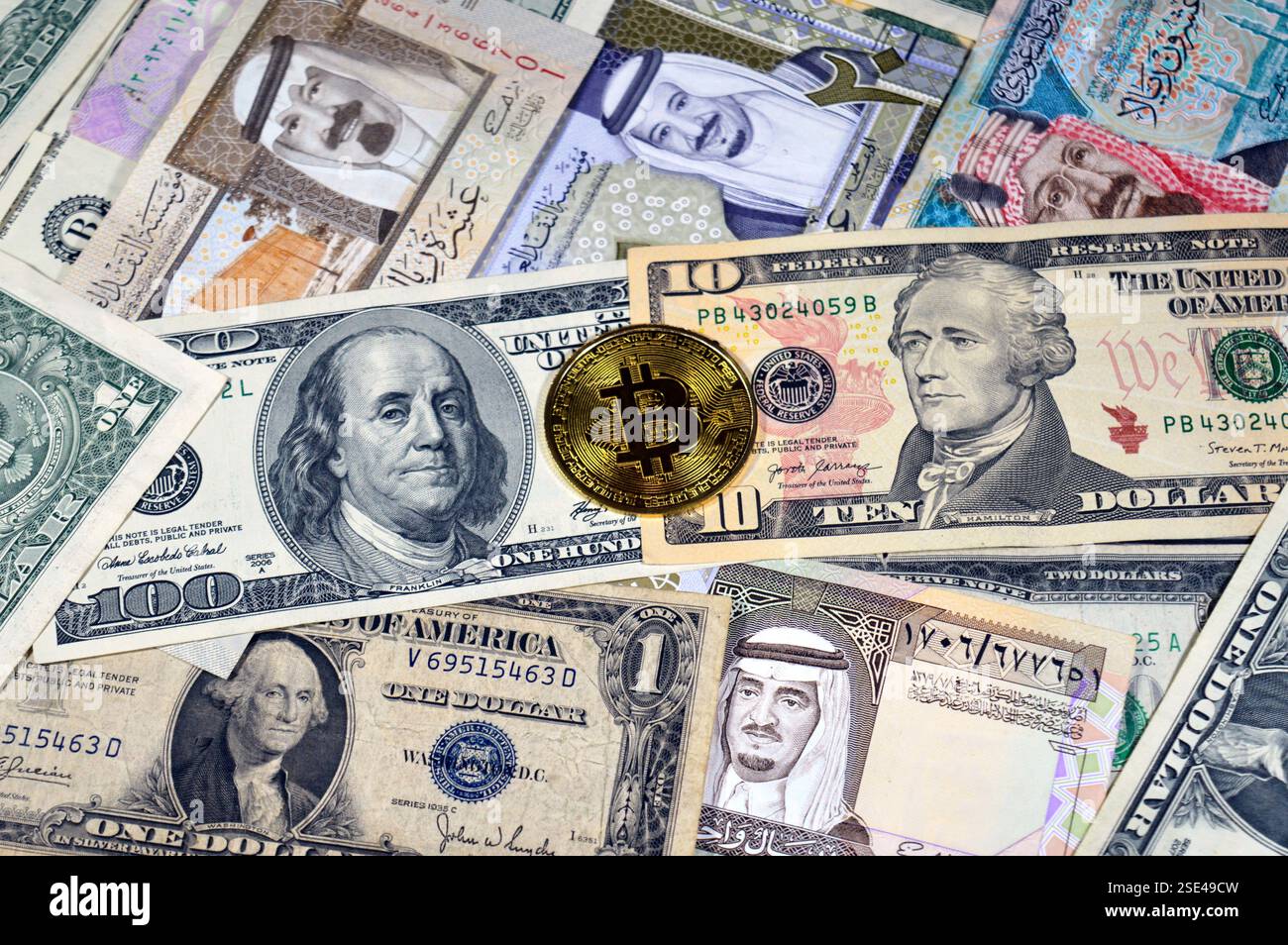 Bitcoin physical golden coin BTC, American money dollars banknotes USD ...