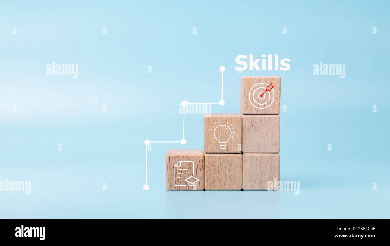 Upskilling, reskilling, new skills icon on wooden cube, Goal is ...