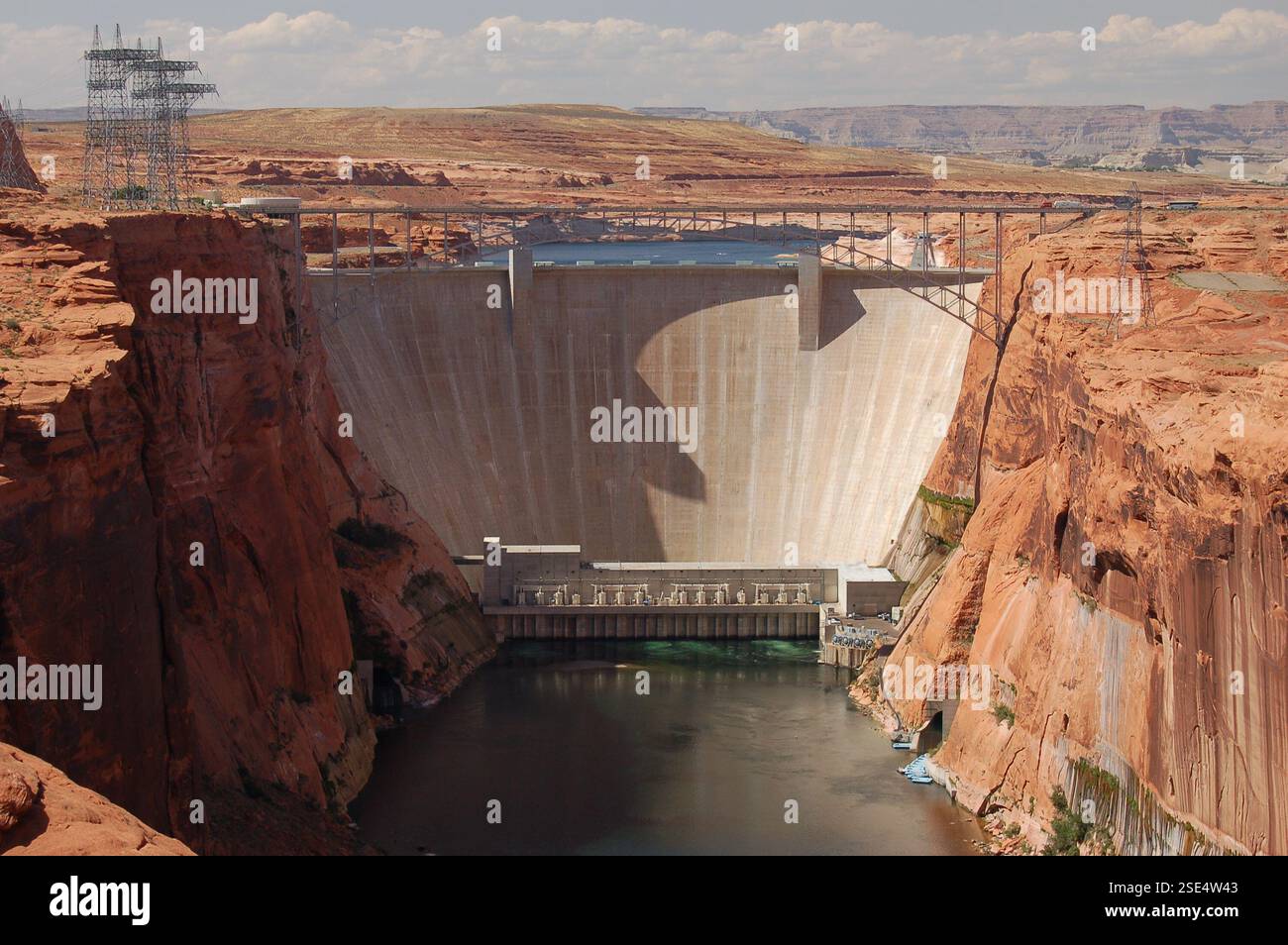 The Hoover Dam harnesses the Colorado River to form Lake Mead along the ...