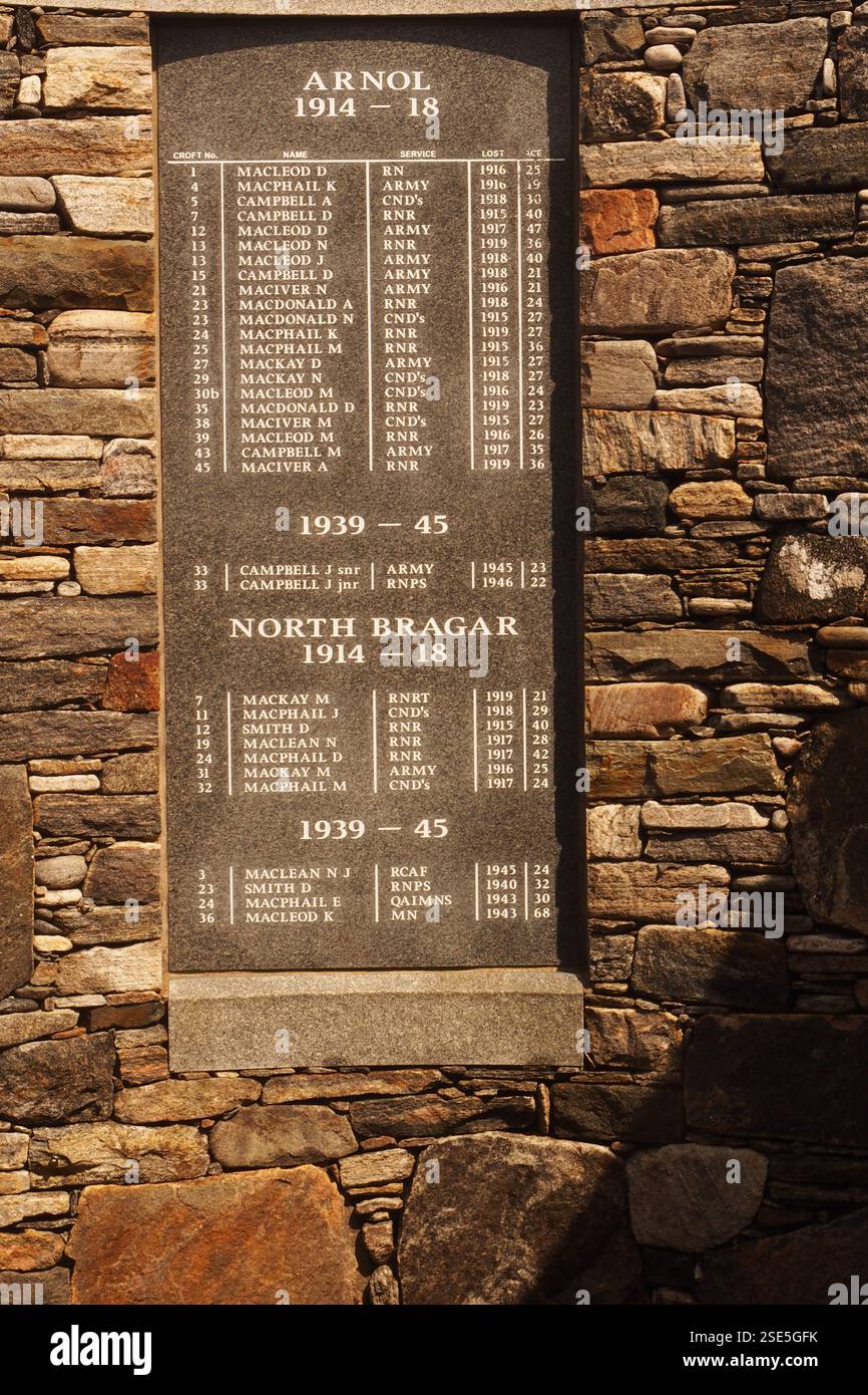 A modern, circular war memorial set in the village of Bragar, Isle of ...