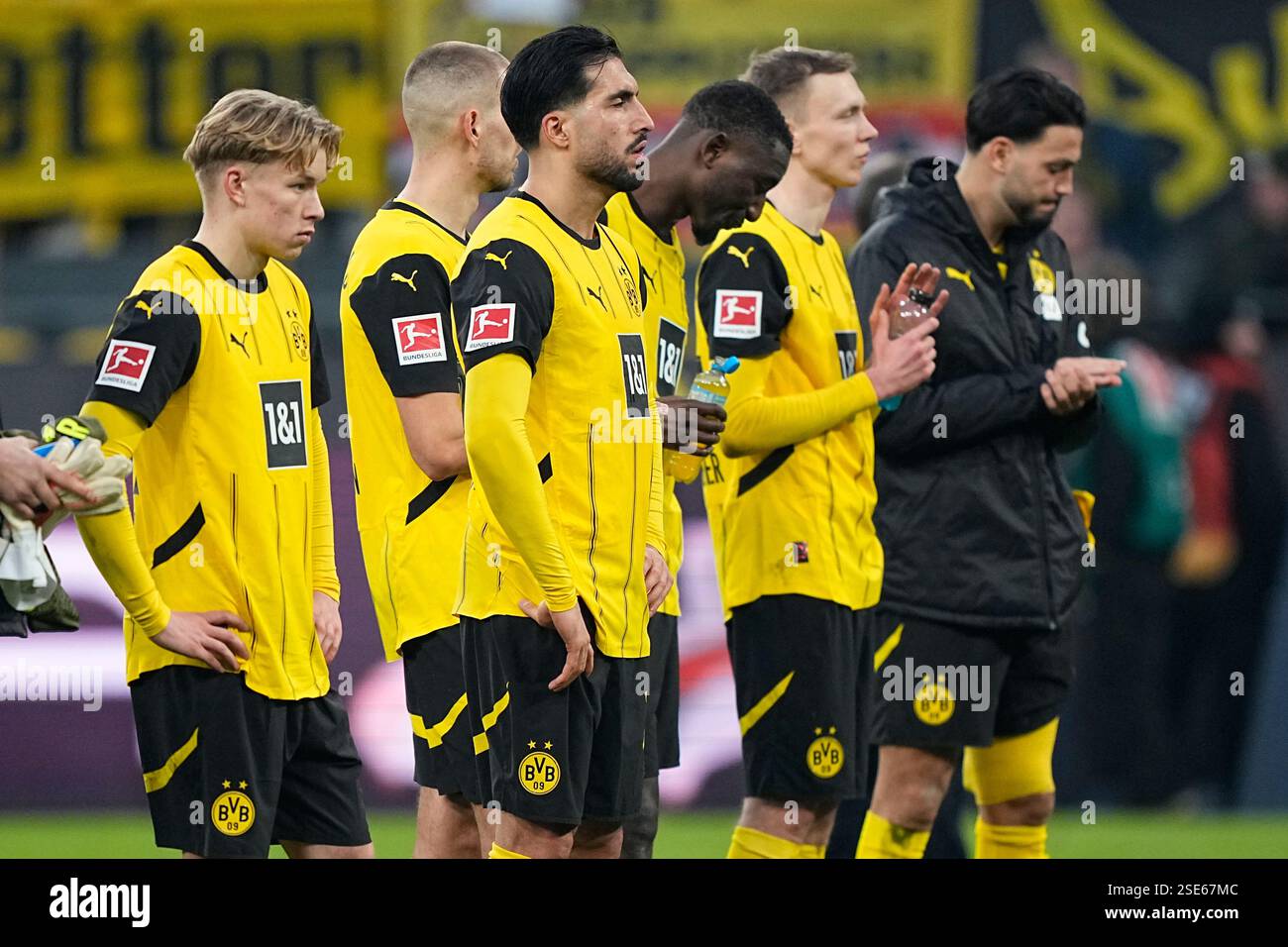 Dortmund players stand on the pitch at the end of the German Bundesliga ...