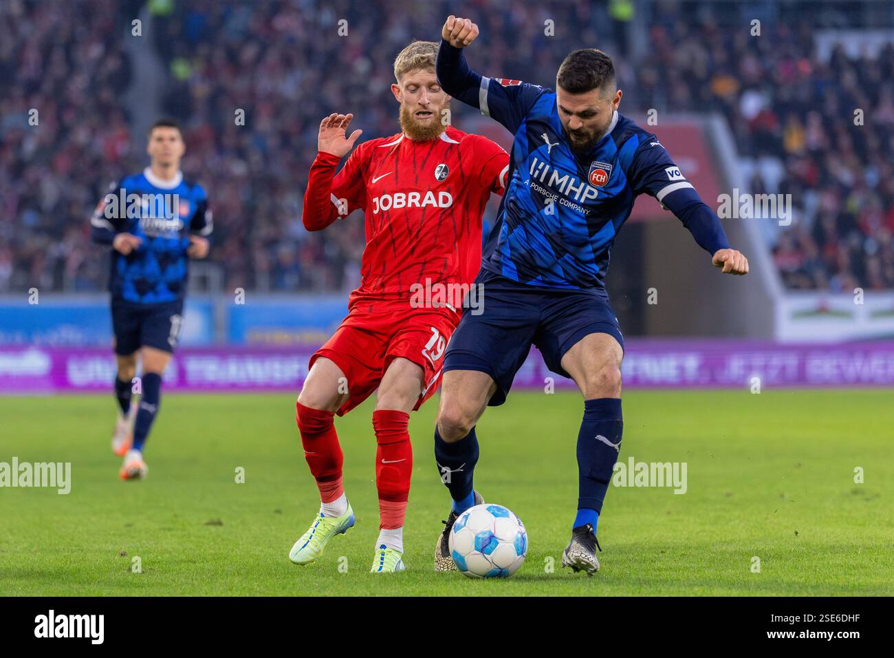 Freiburg, Germany, February 08st 2025: A duel between Niklas Beste (19 Freiburg) and Marnon ...