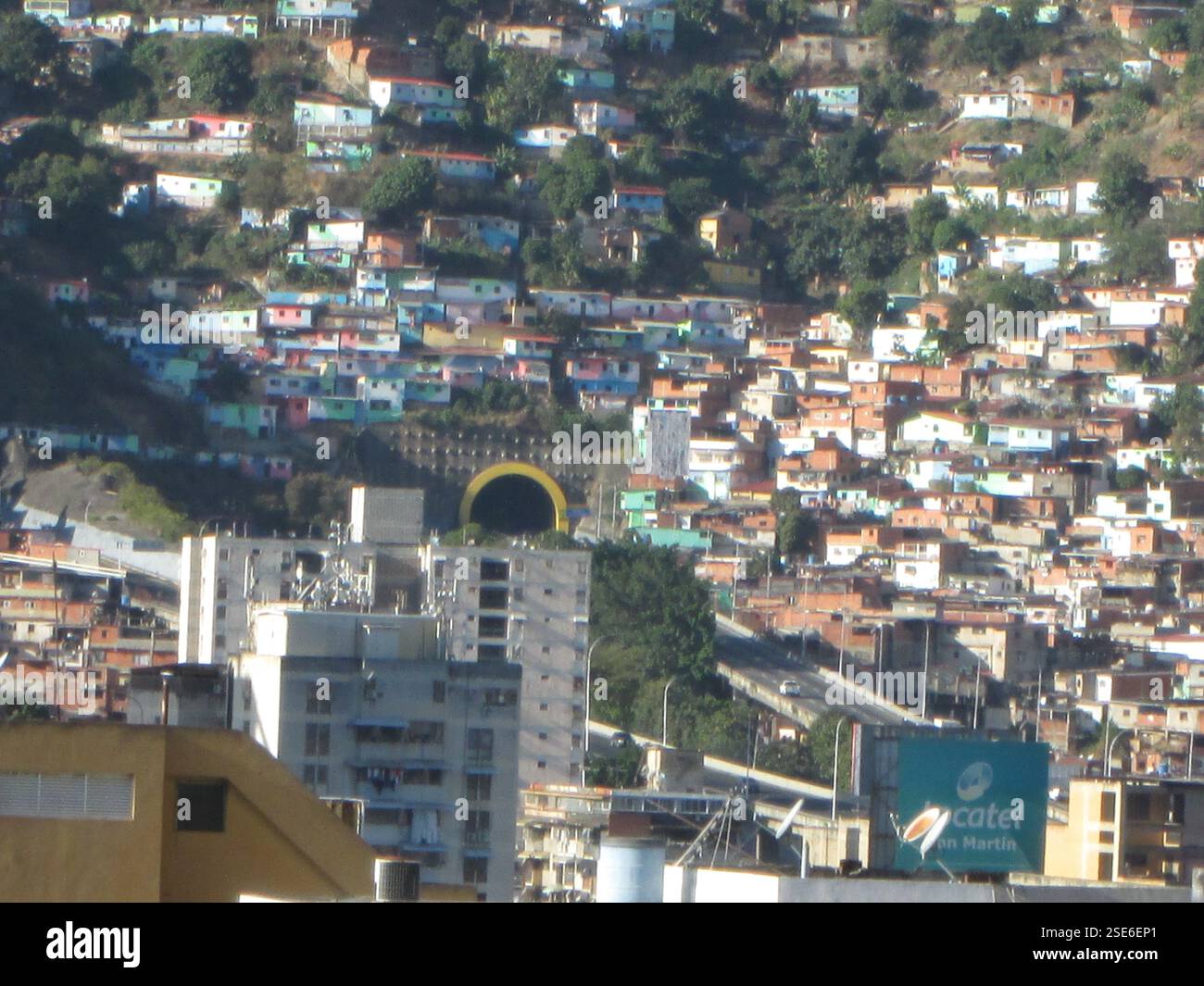 Slum houses in hillside and tunnel. Editorial. Venezuela, Caracas ...